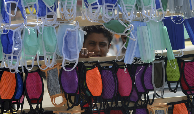 Karachi makes face masks mandatory as coronavirus cases surge in ...