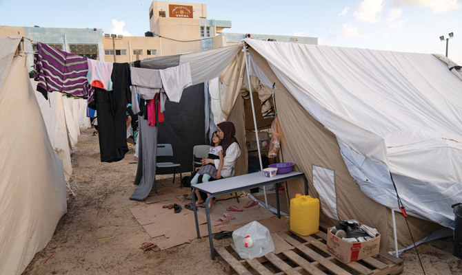 A tent camp for the displaced pops up in southern Gaza, reawakening old ...